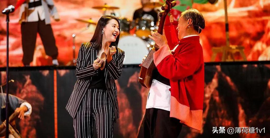 With tattooed arms and eight-pack abs, female rock singer Tan Weiwei is ...