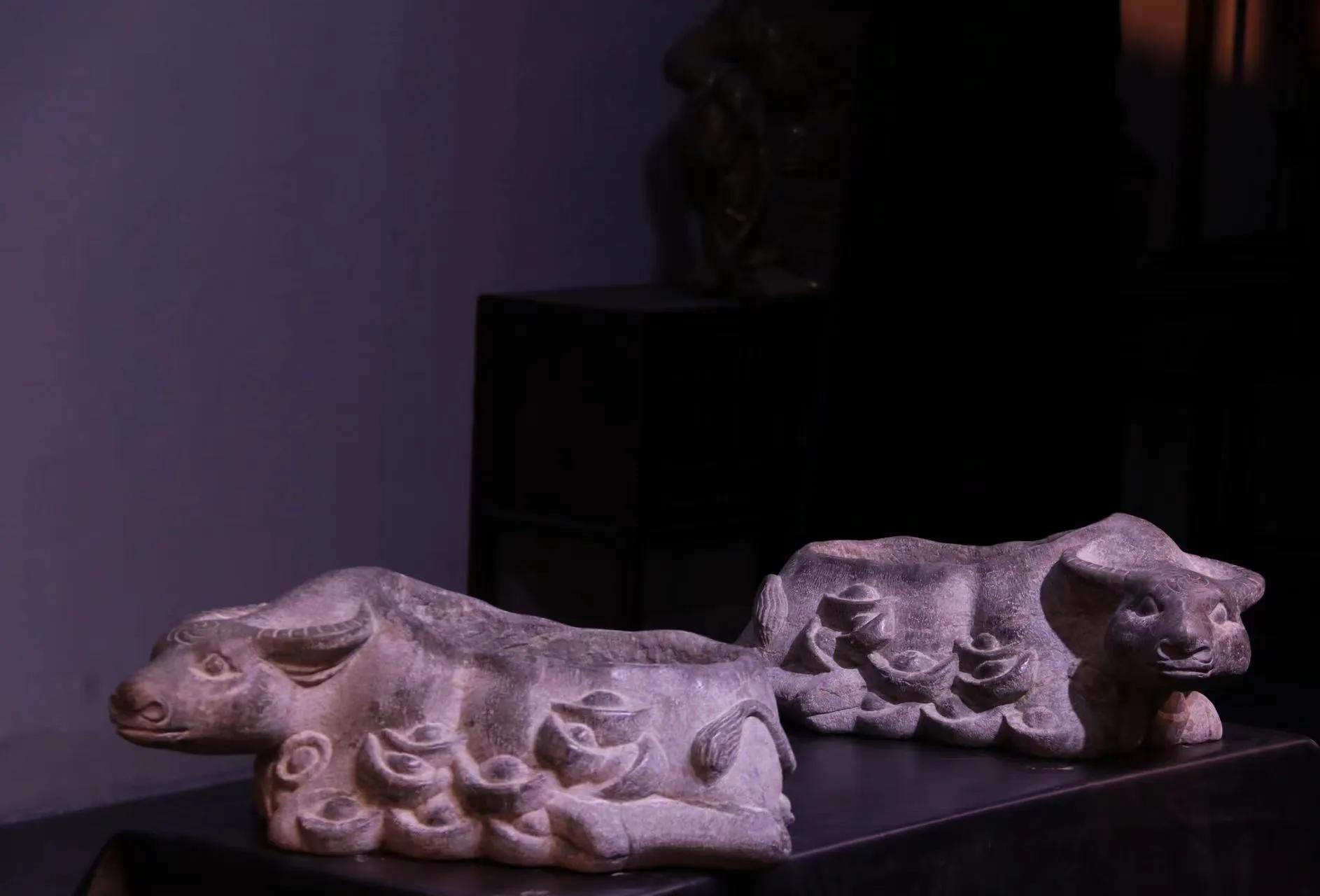 A pair of bluestones in a stone cow basin - iNEWS