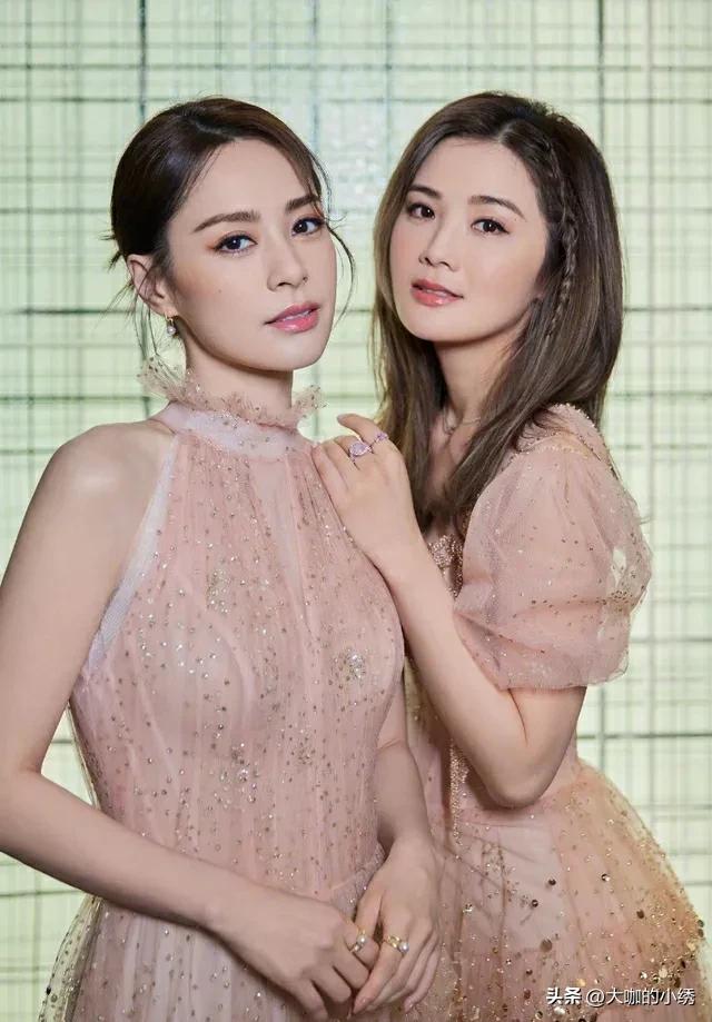 Charlene Choi and Gillian Chung fit together for a photo shoot, wearing ...