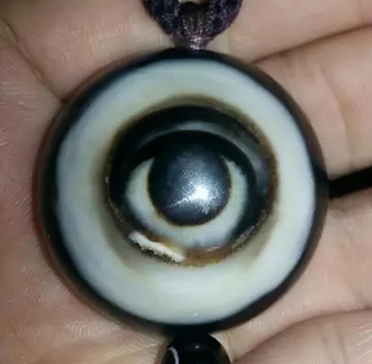 There are only 2 Nine-Eyed Dzi Beads left in the world. Jet Li bought ...