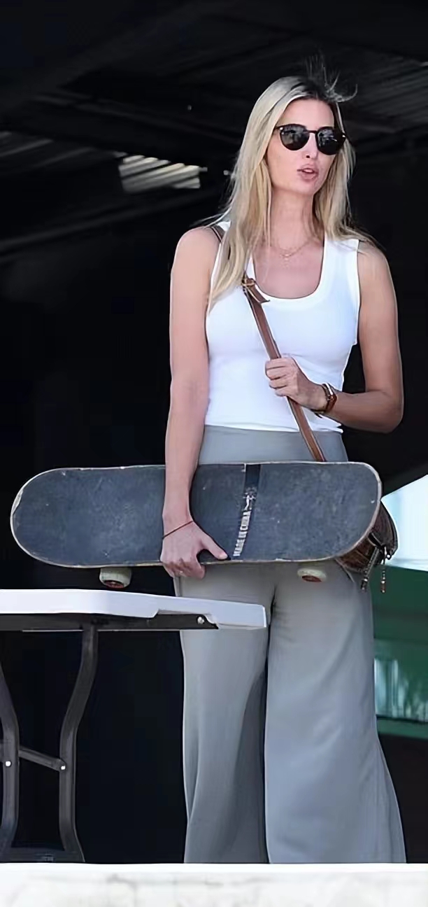 Ivanka looks like a real Barbie after tanning! Wearing a tight vest to ...