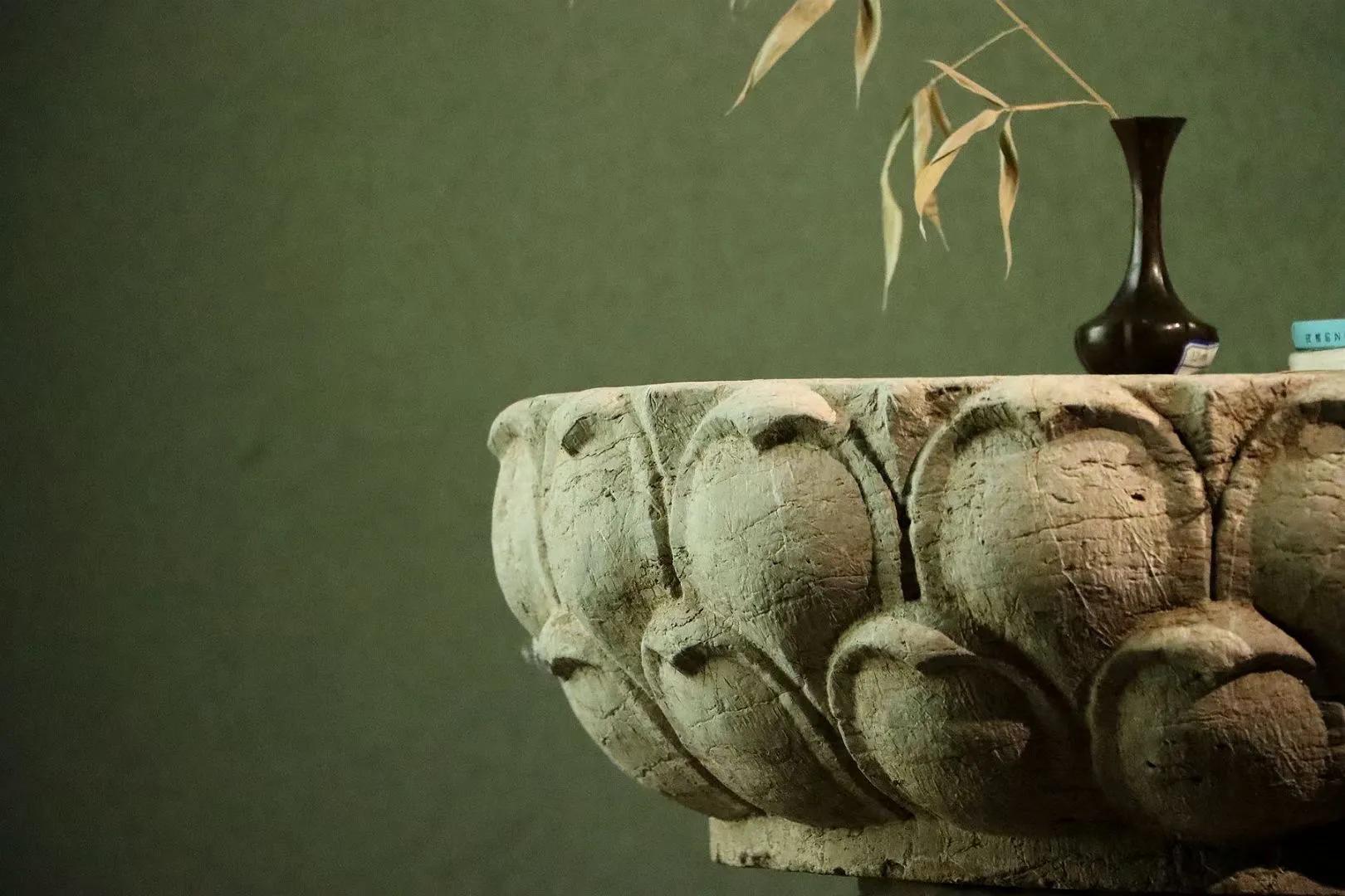 The bluestone lotus Buddha sits on this vessel. The workmanship is very ...