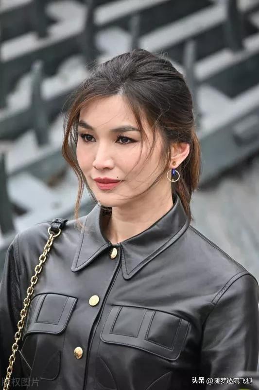Gemma Chen is handsome and capable in a black leather shirt skirt + boots - iMedia