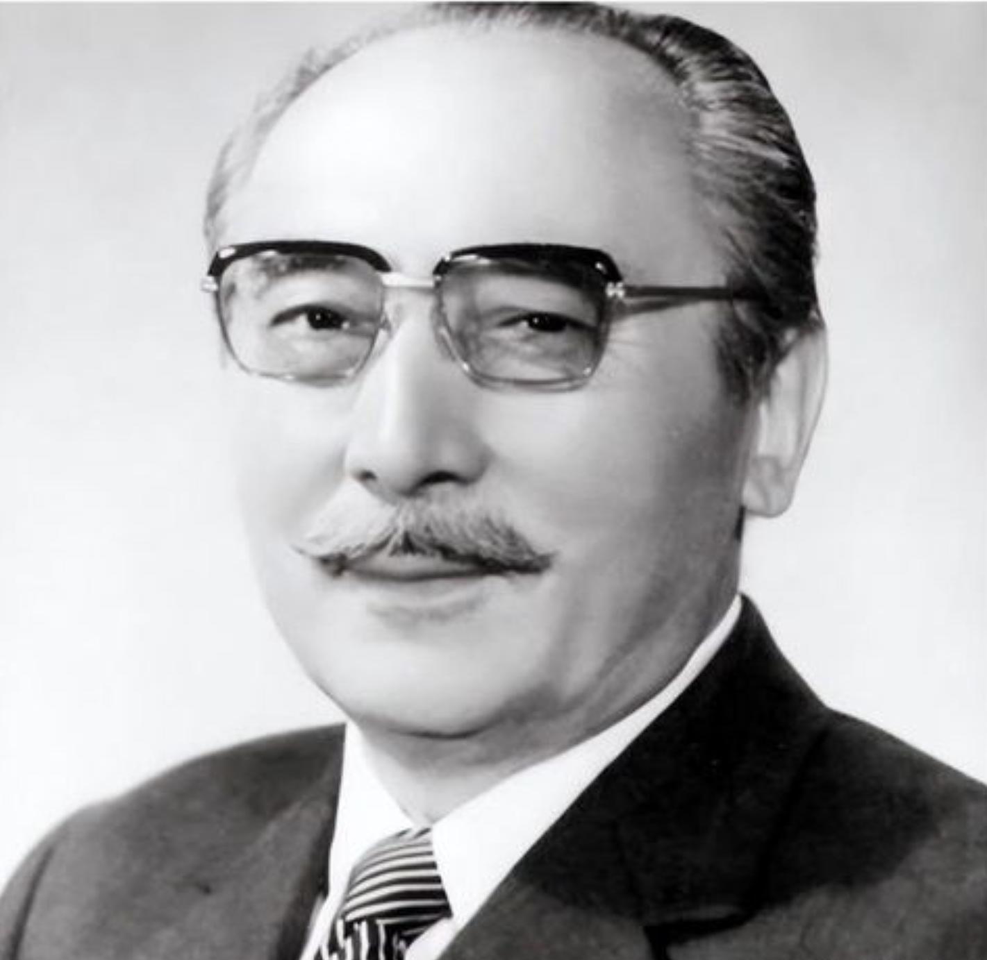 At the founding ceremony in 1949, a young man wearing a black hat stood ...
