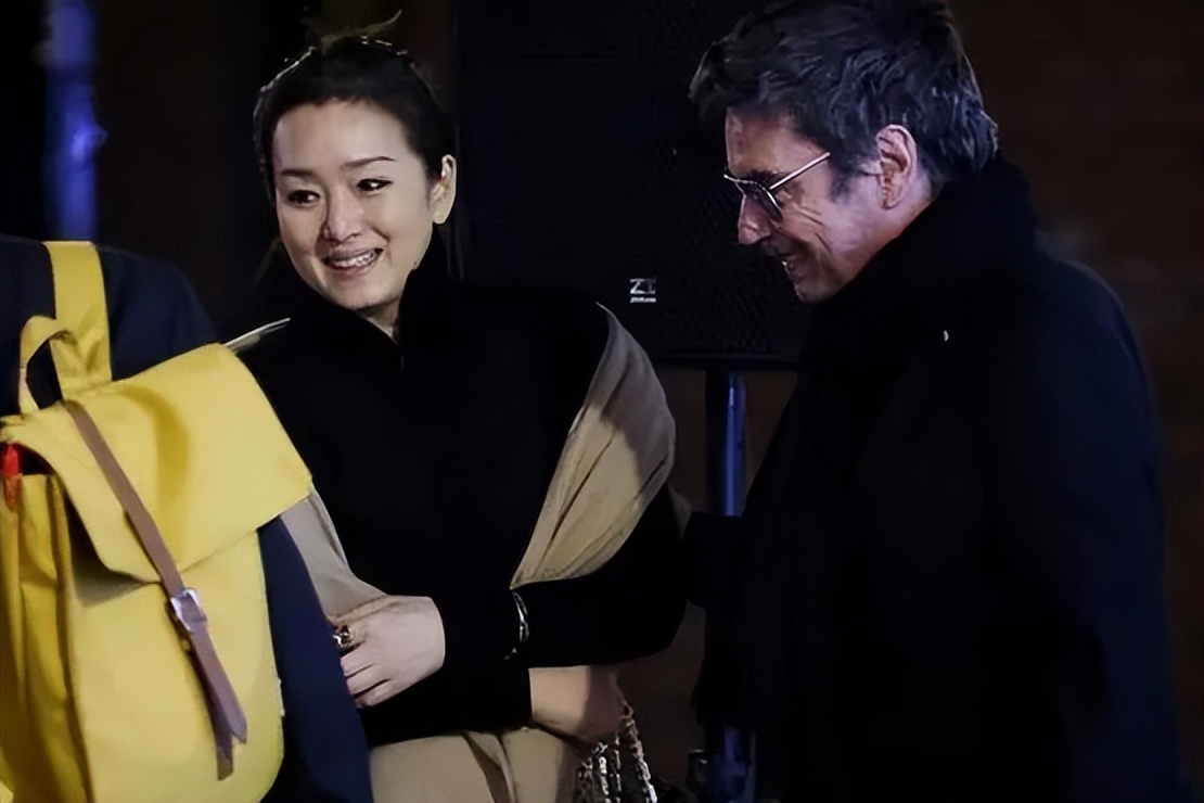 Gong Li and her husband walked the red carpet in Cannes, dressed in a ...