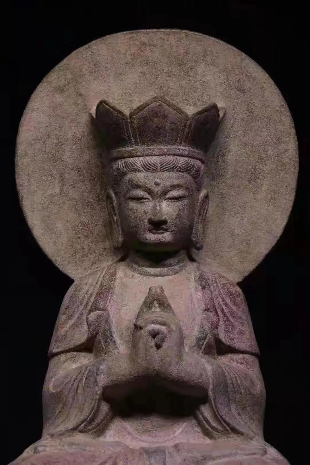backlit seated buddha - iNEWS