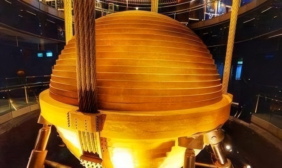 Why is a large iron ball of hundreds of tons suspended in a skyscraper ...