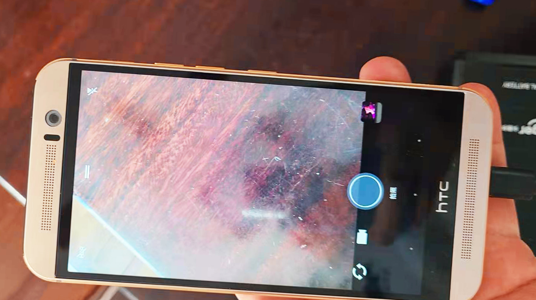 The all-metal body has a rounded shape. This HTC mobile phone has a ...