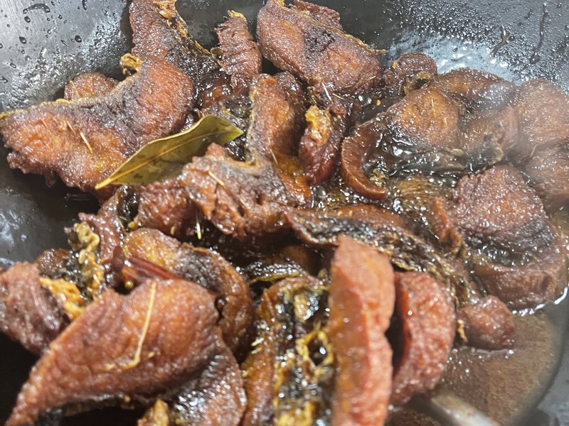 Fried fish, sweet and sour, smoked fish with cold dishes on the New ...