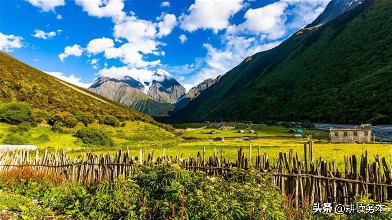 The village at the foot of the snow-capped mountains in Tibet, where ...