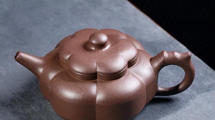How do the dragon and phoenix patterns in the purple clay pot appear on ...