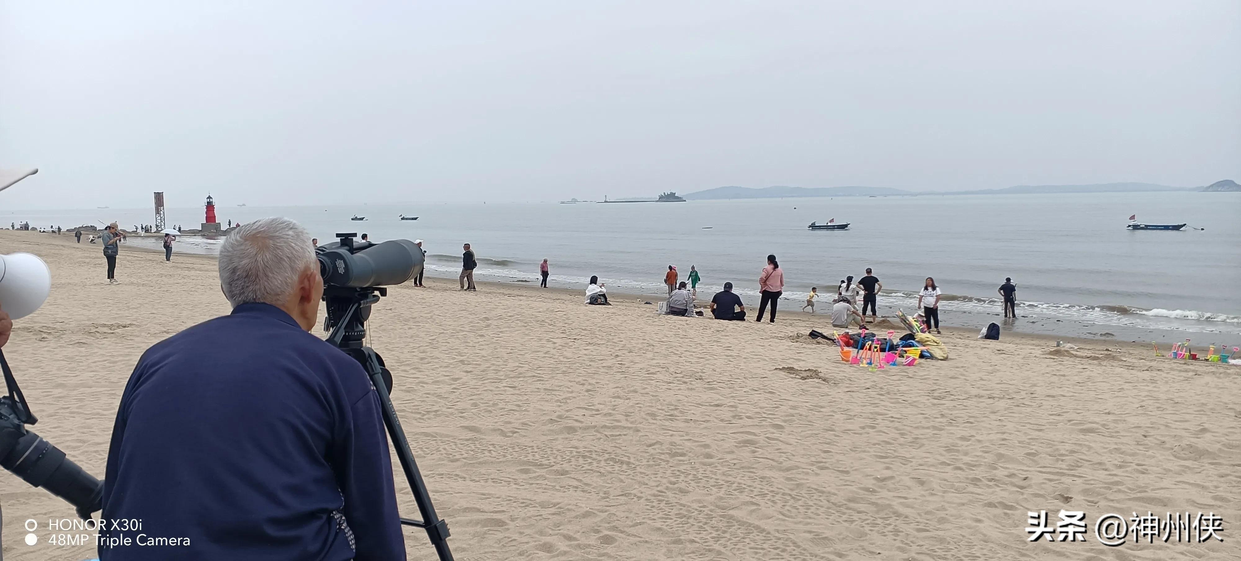 Lenovo standing on the beach in the "One Country, Two Systems" Square ...