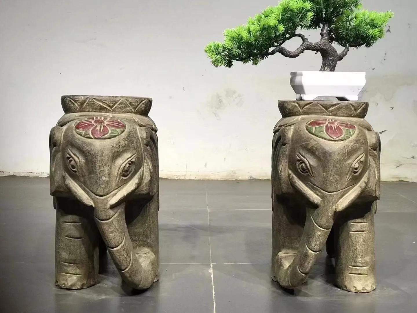 A pair of bluestone painted lucky elephants in size.40 long.The high 30 ...