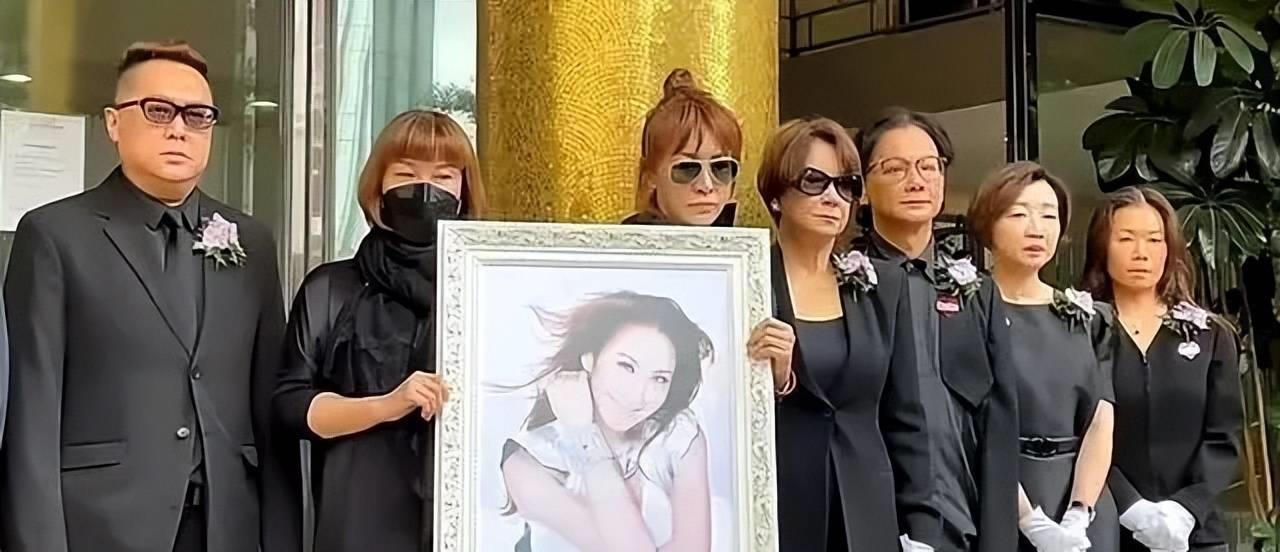 A white marble angel statue stands at Coco Lee Cemetery, commemorating ...