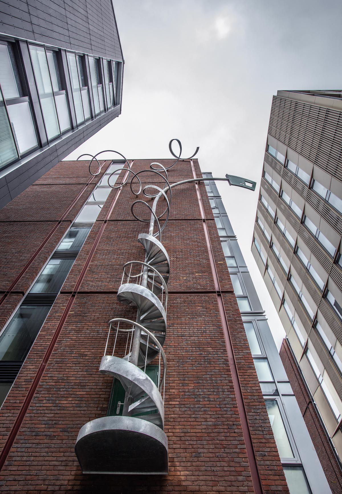 Art spiral staircase in surreal architectural sculpture - iNEWS