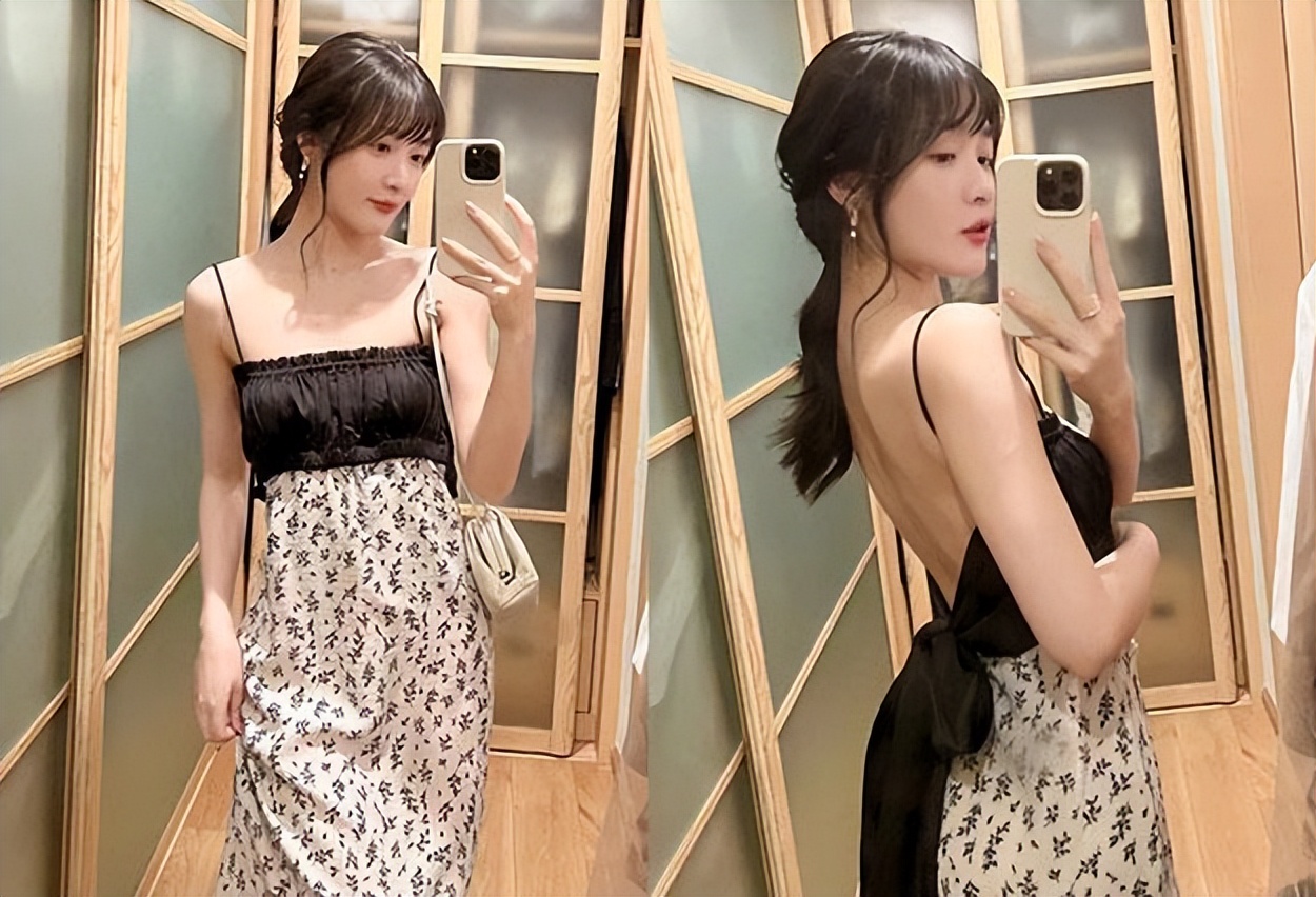 Xu Jiao was taking a selfie in the fitting room, wearing a low-neck long dress to show her ...