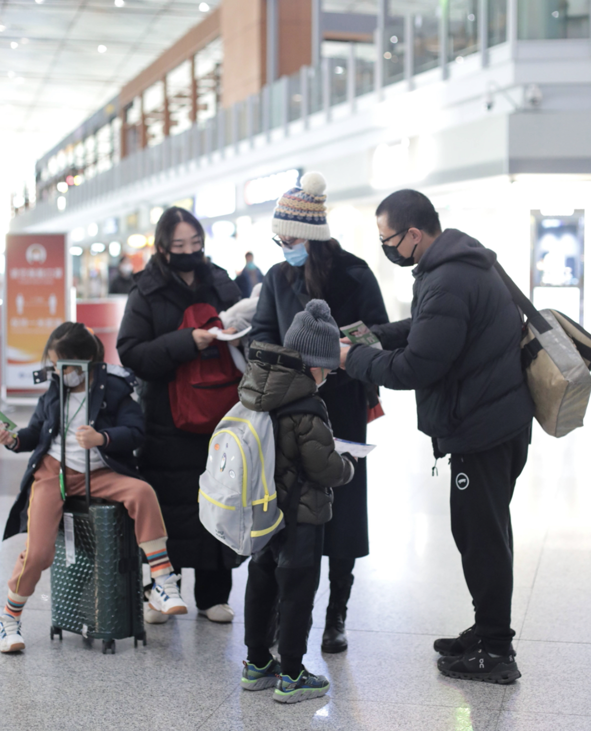Mei Ting's family of four rarely share the same frame, their children ...