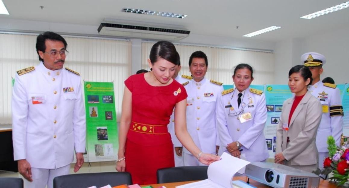 Sirami is stunning in a red dress, with a sharp smile on her face. She ...
