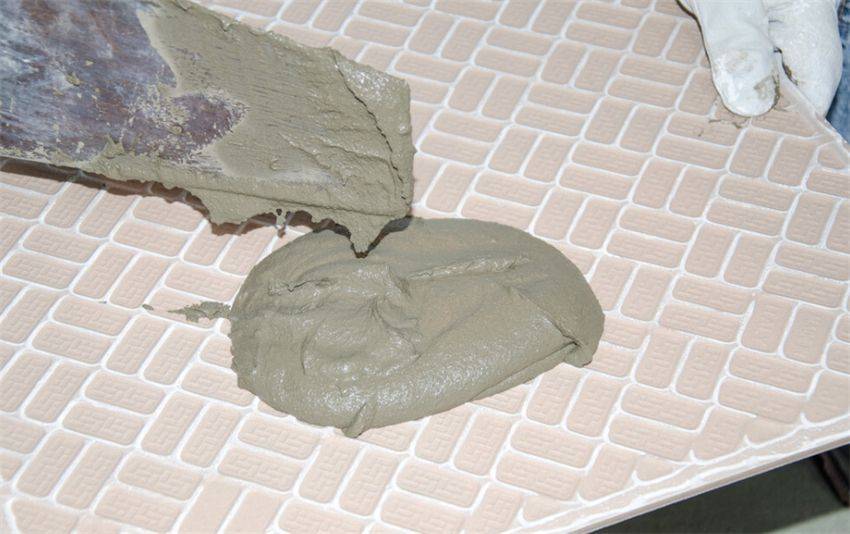 What is the difference between dry laying and wet laying of tiles? When ...