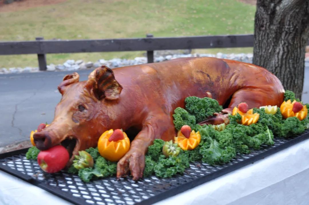 What is the origin of the apple in the mouth of the roast suckling pig ...