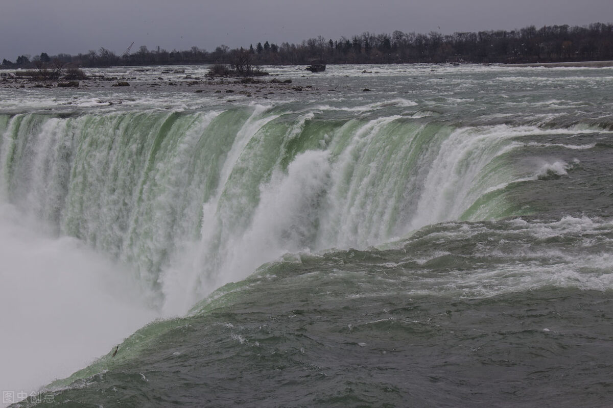 The thousand-foot Pearl Falls are surrounded by steep cliffs with ...