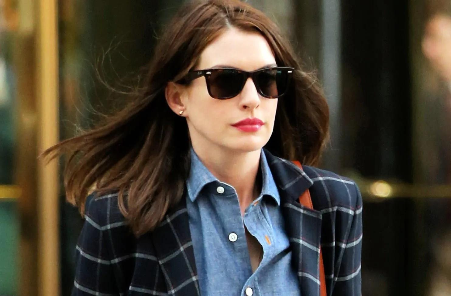 Anne Hathaway's suit styles in various periods are capable and feminine ...