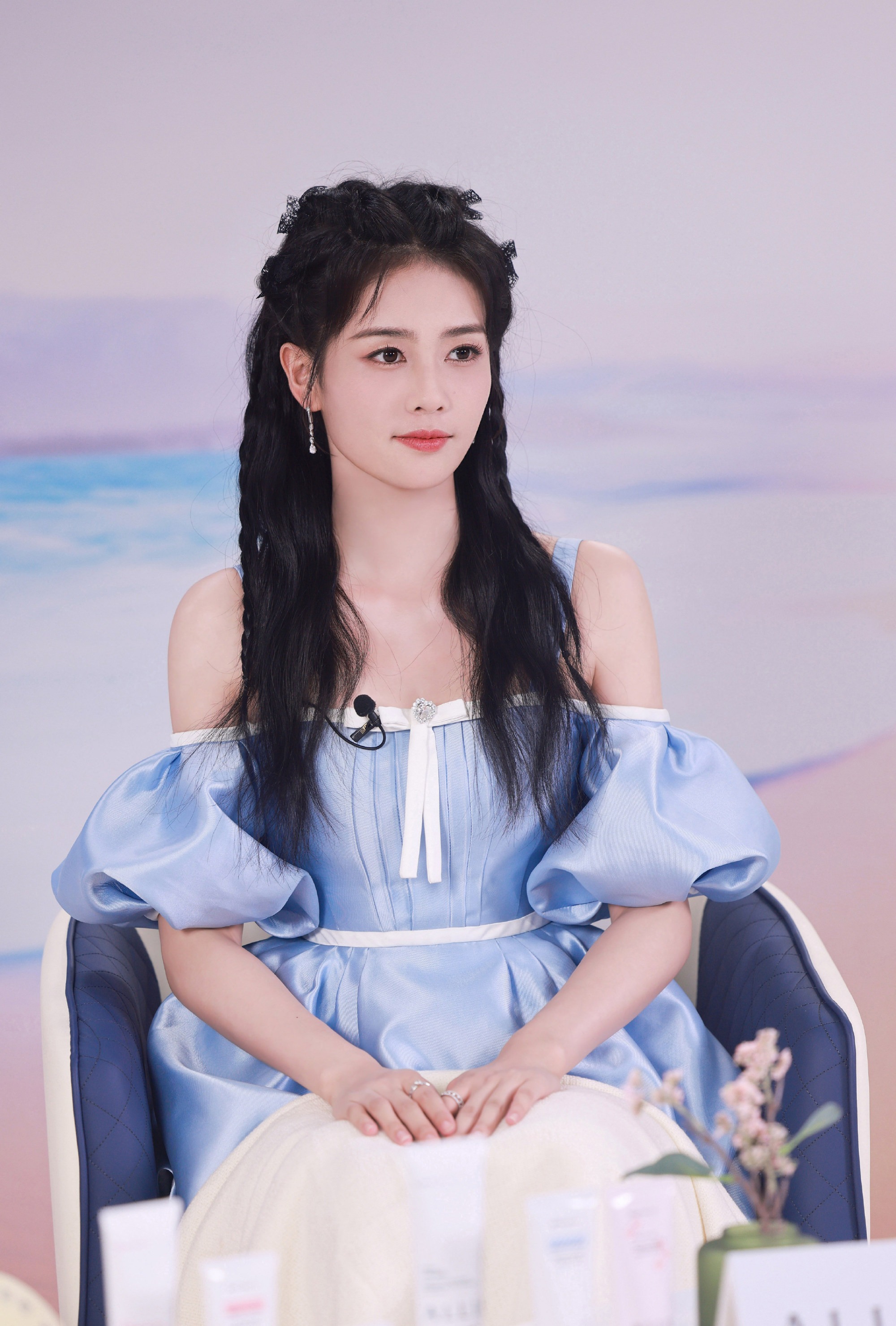 Bailu looks like a princess on the run in a light blue off-the-shoulder ...