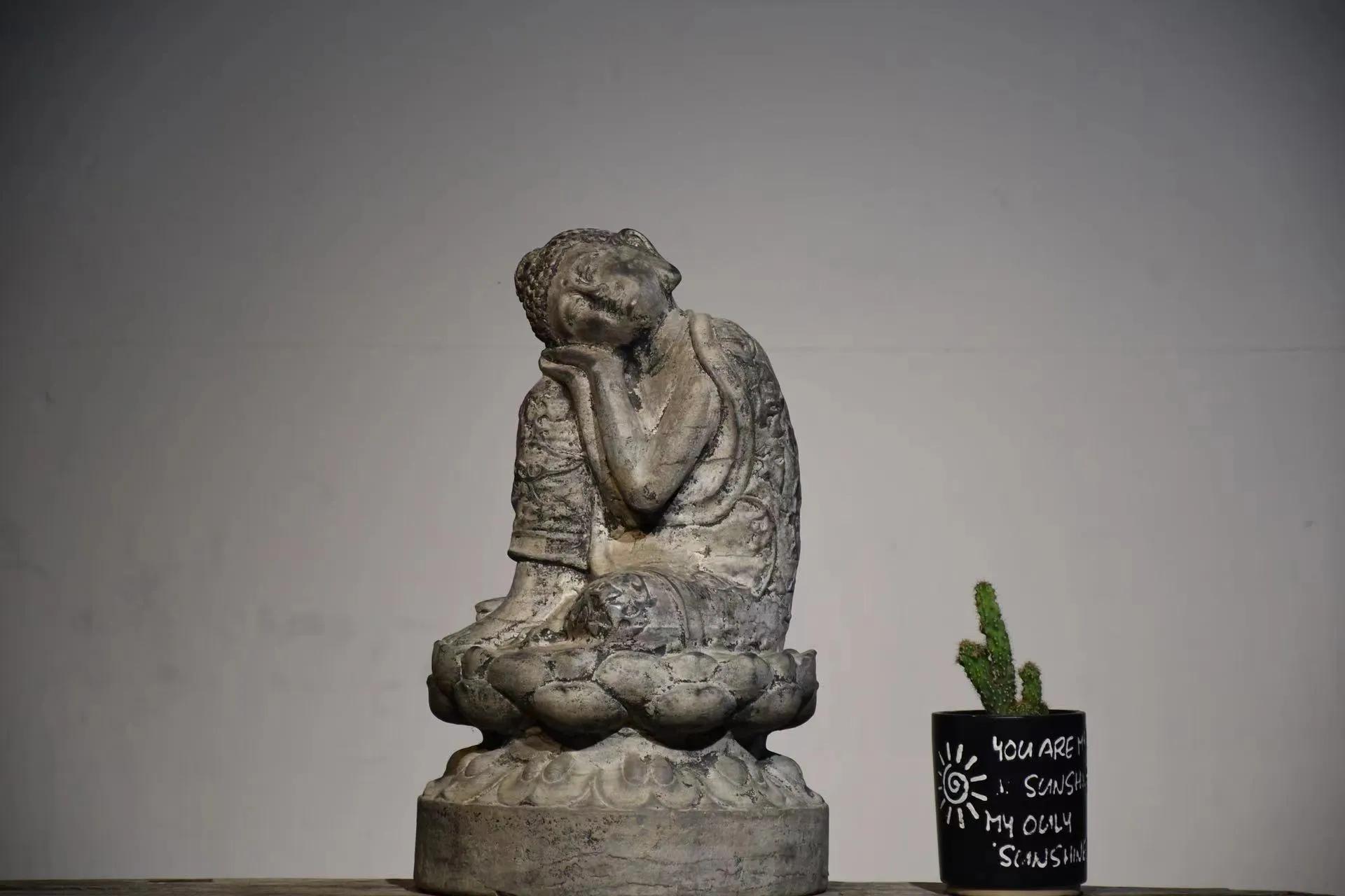 The sleeping Buddha's bluestone lotus base is wrapped around the lotus ...