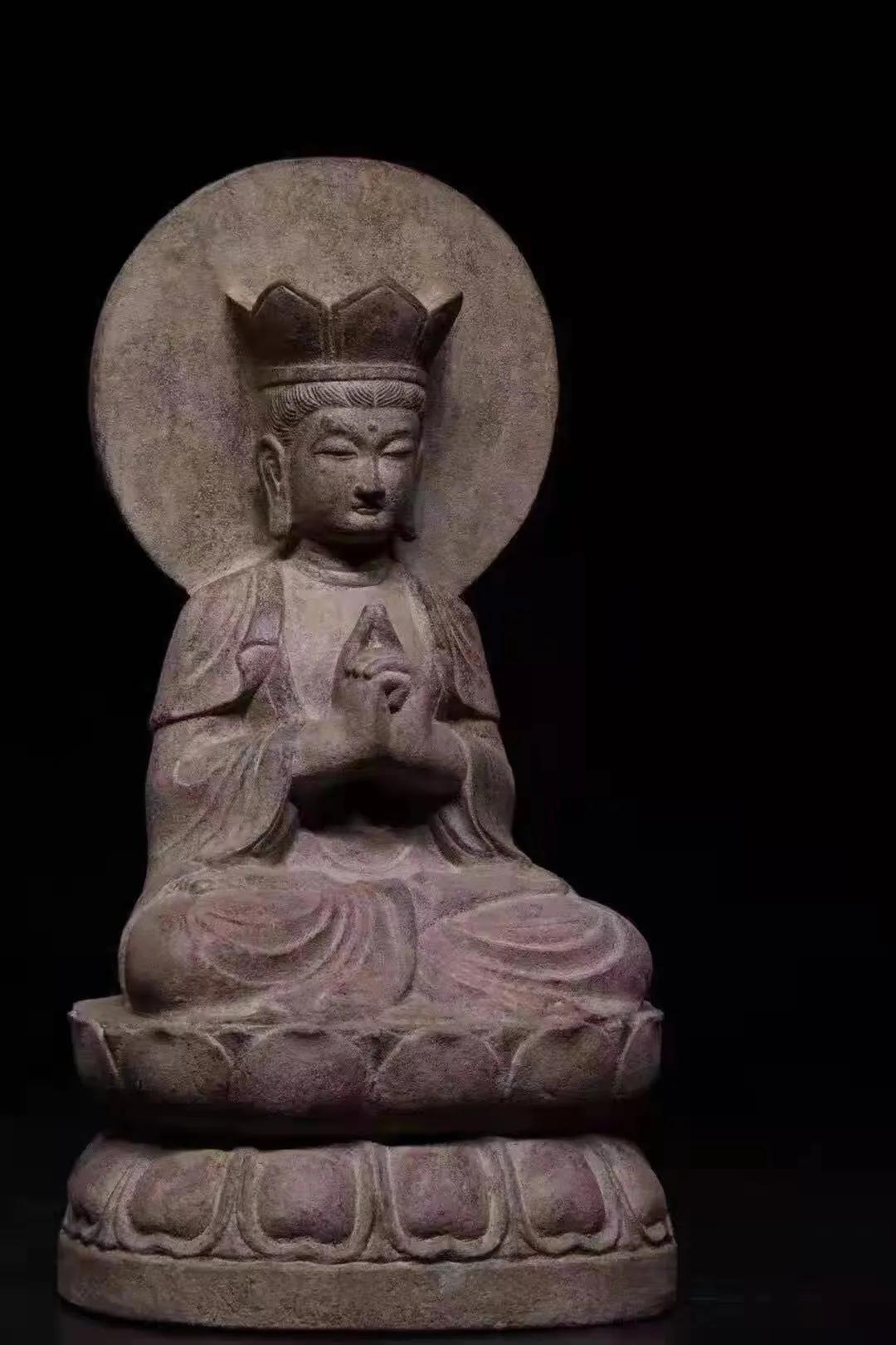 backlit seated buddha - iNEWS