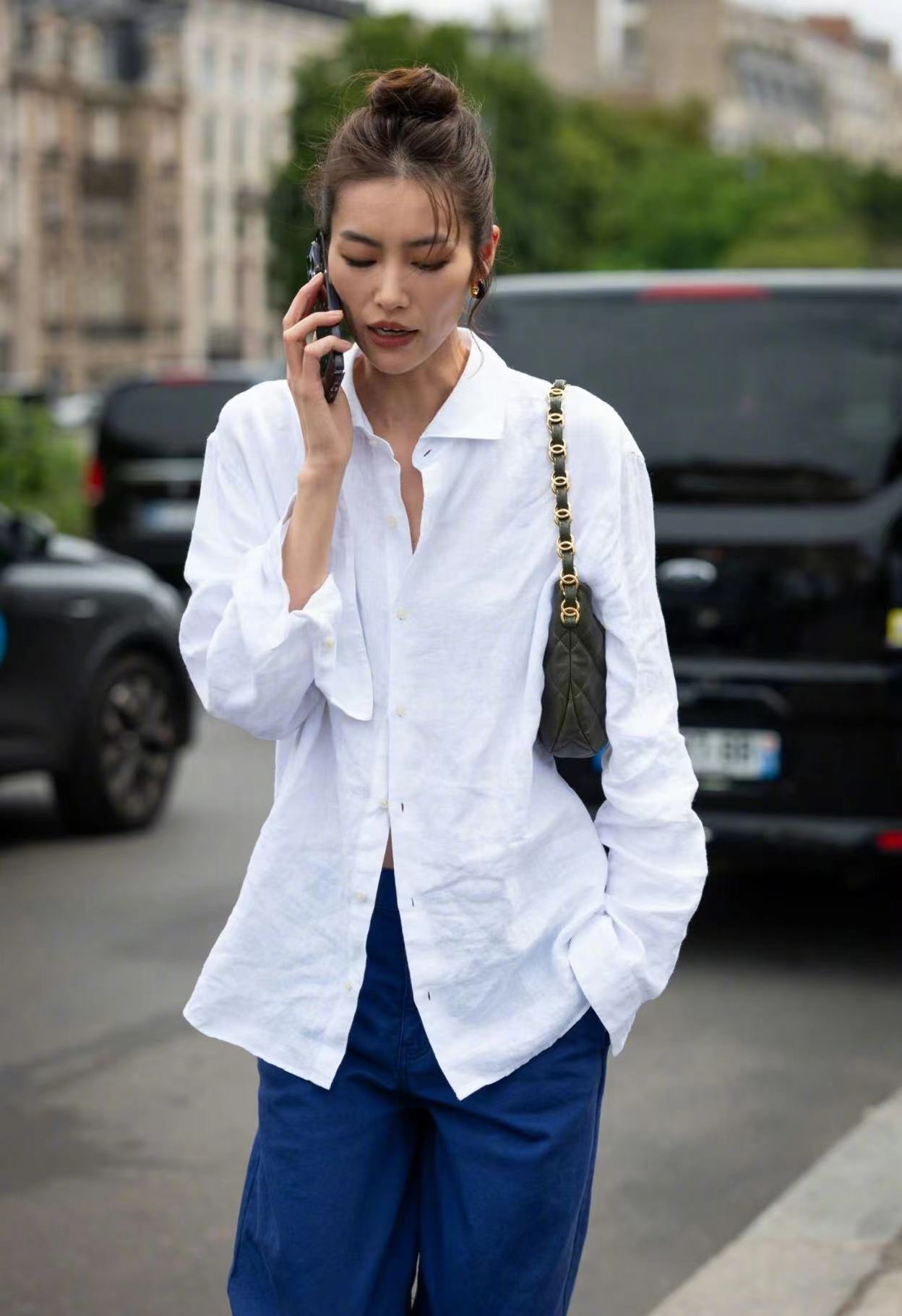 Liu Wen looks amazing in a shirt! Only buttoning two buttons is awesome ...