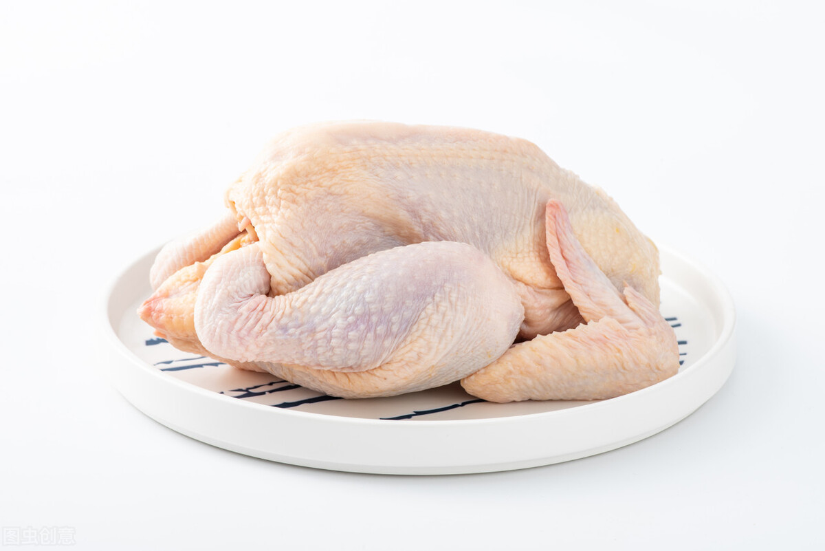 New Year's Eve dinner, a dish of white-cut chicken served on the table ...