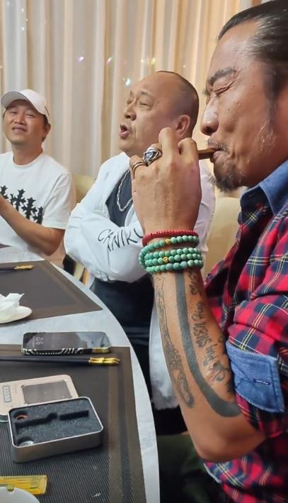 59-year-old Sun Xing was partying with friends, wearing a turquoise ...