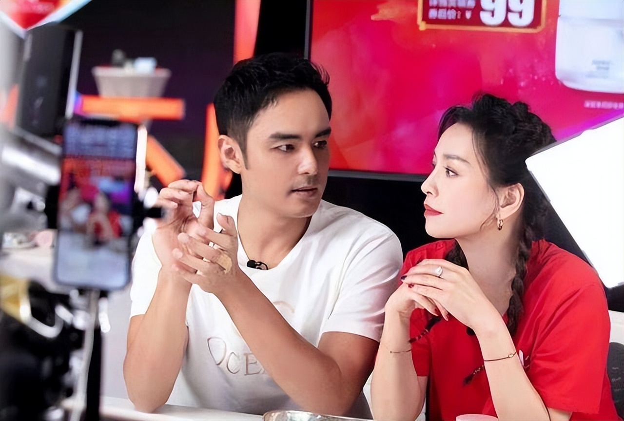 Ming Dao accompanies his mother for a walk in the park. His 2-year-old ...