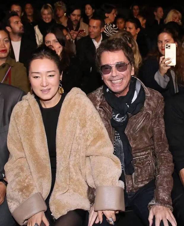 Gong Li and 74-year-old French husband watch the show in a low-key ...