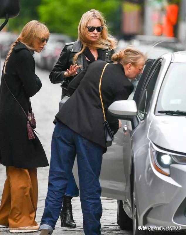 Kate Moss is neat and handsome in a black motorcycle leather jacket ...